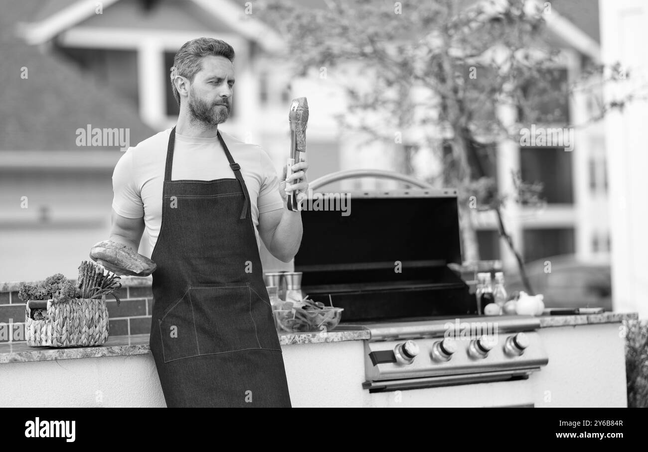 chef man cooking grilled salmon outdoor with copy space. grilled salmon ...