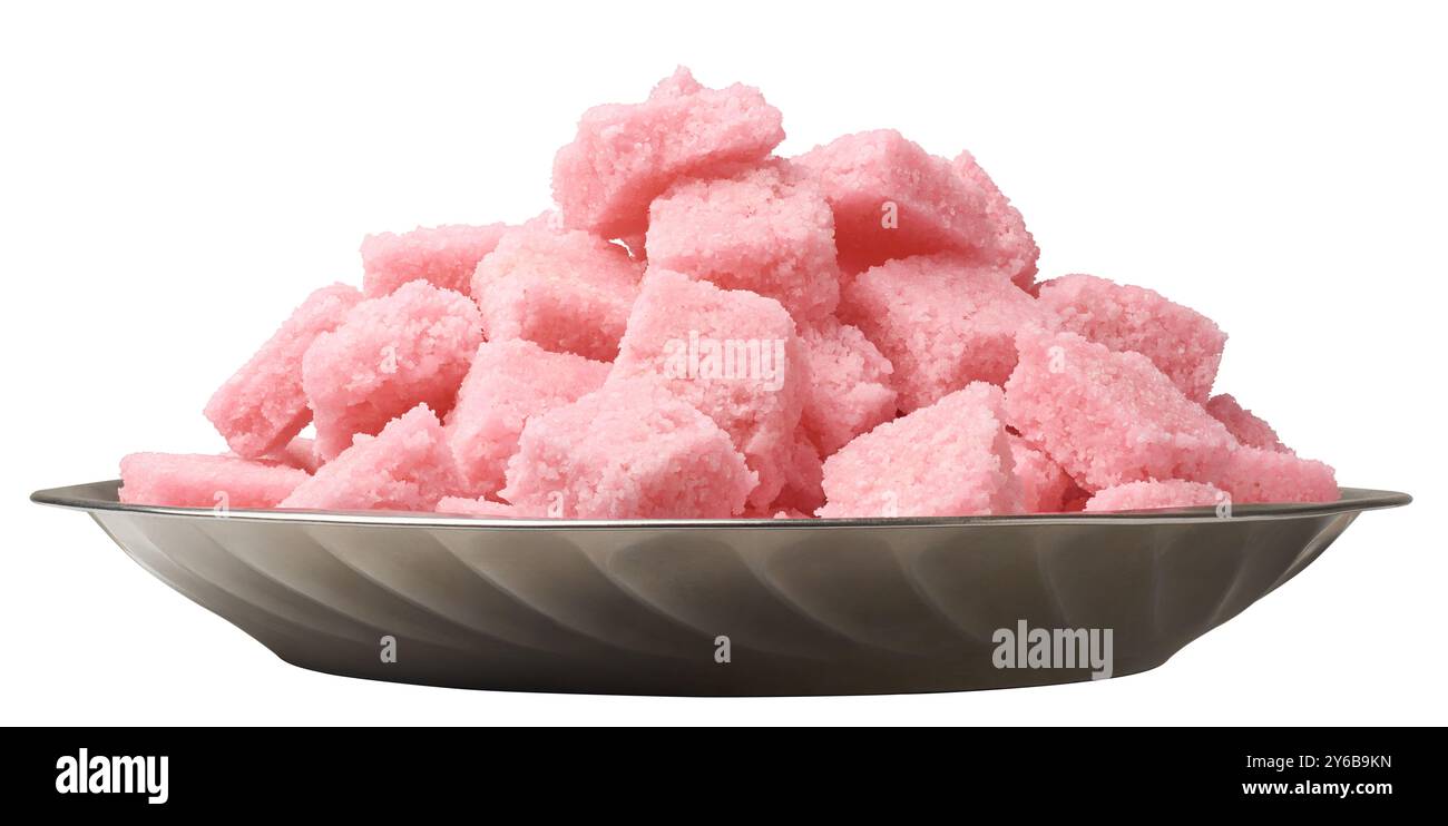 colorful coconut toffees on plate isolated white background ...