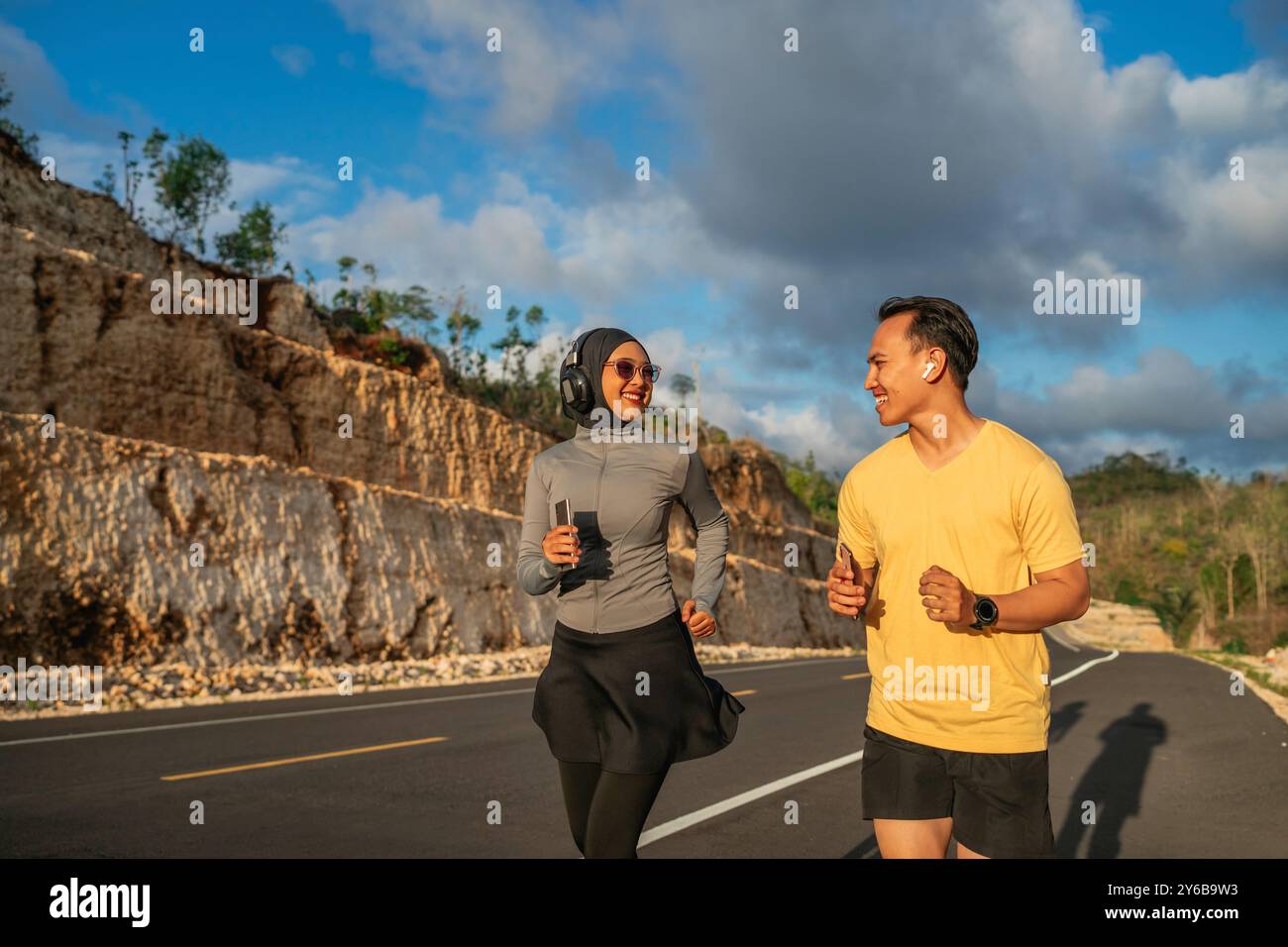 happy sporty couple enjoying running together Stock Photo - Alamy