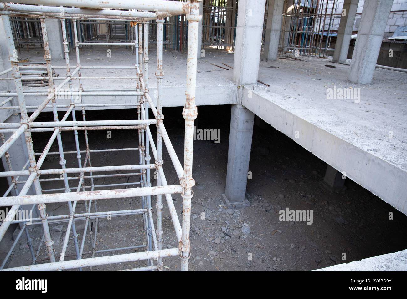 An opening in the interfloor ceiling of a building under construction ...