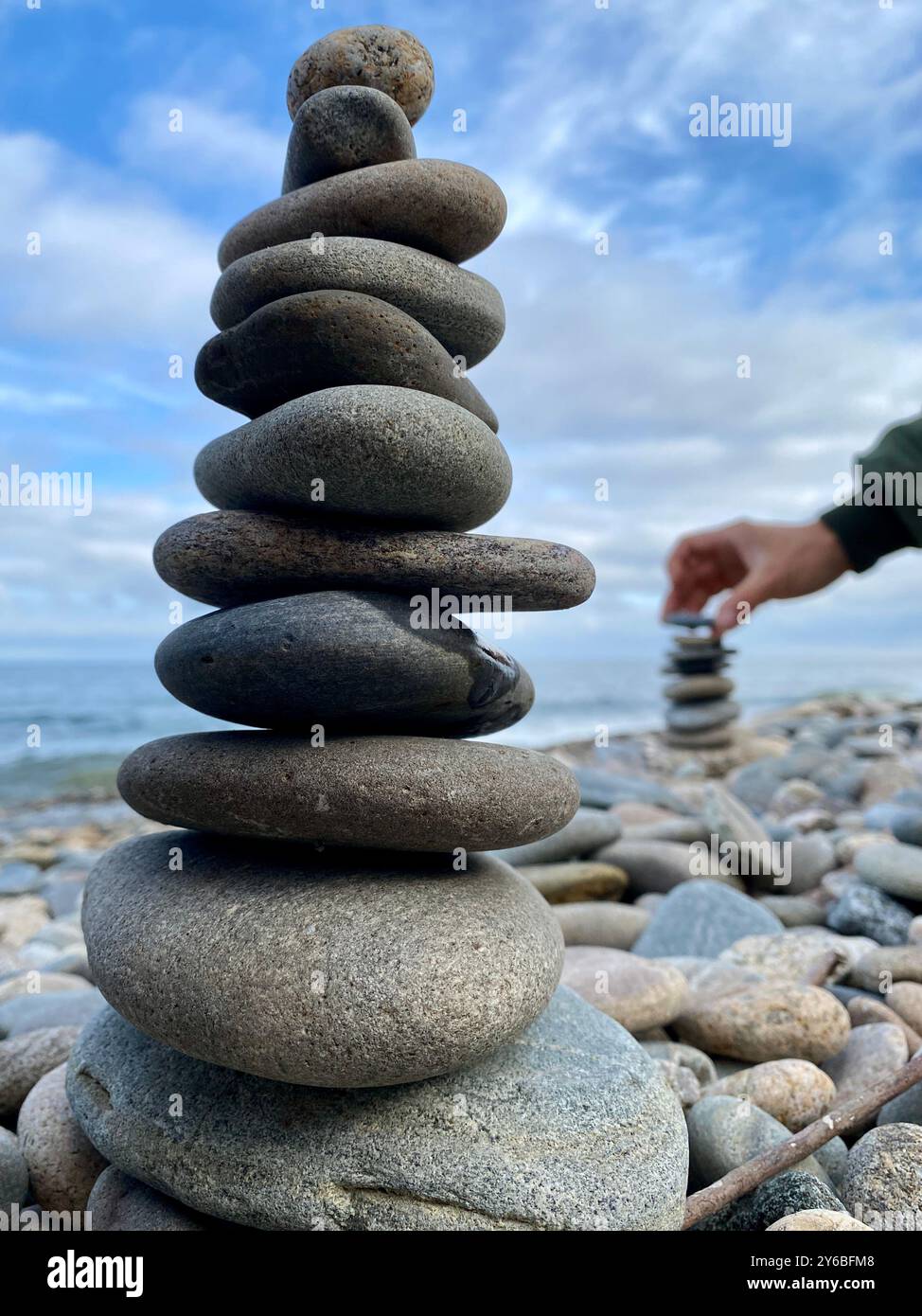 A pyramid of stones on the shore of Lake Baikal, a place of power, the ...