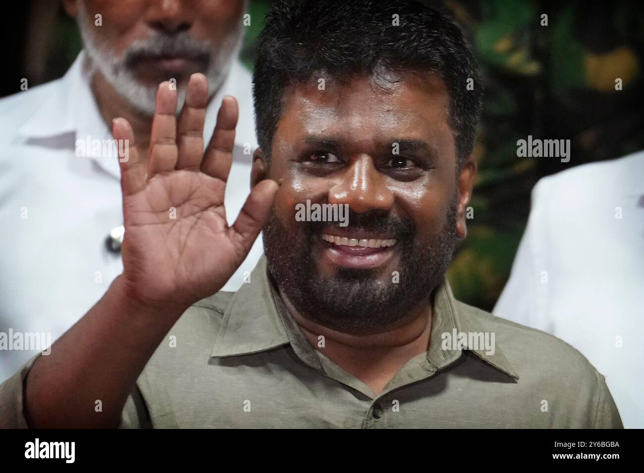 FILE -Marxist lawmaker Anura Kumara Dissanayake waves as he leaves from ...