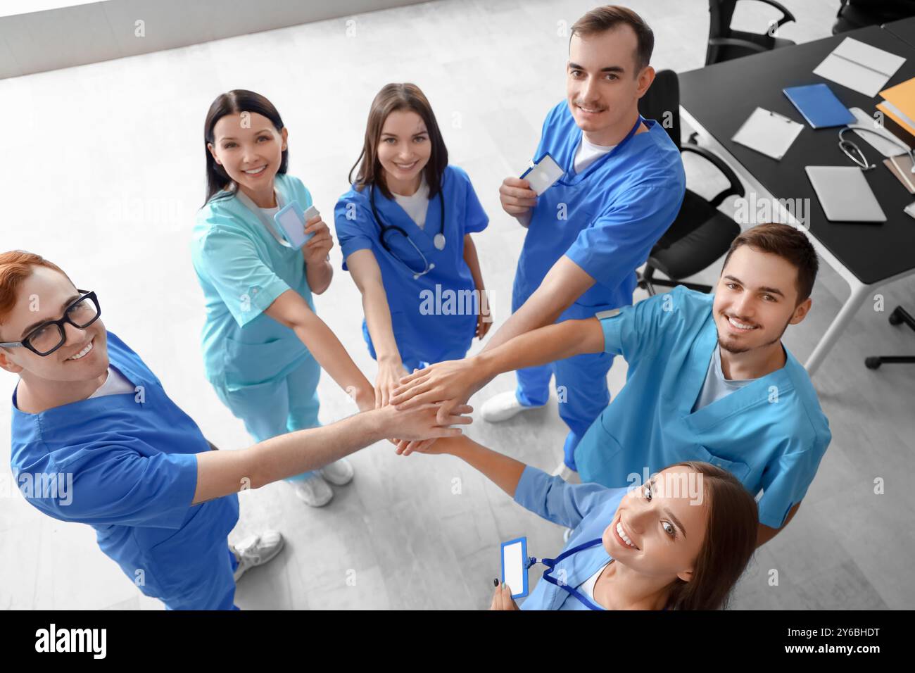 Group of medical students putting hands together at university, top ...