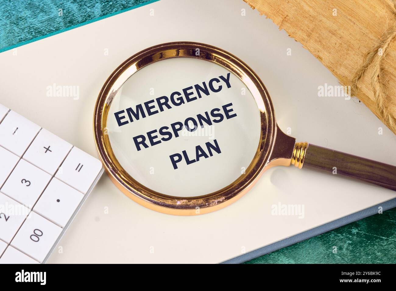 ERP as EMERGENCY RESPONSE PLAN written through a magnifying glass in a business book Stock Photo ...
