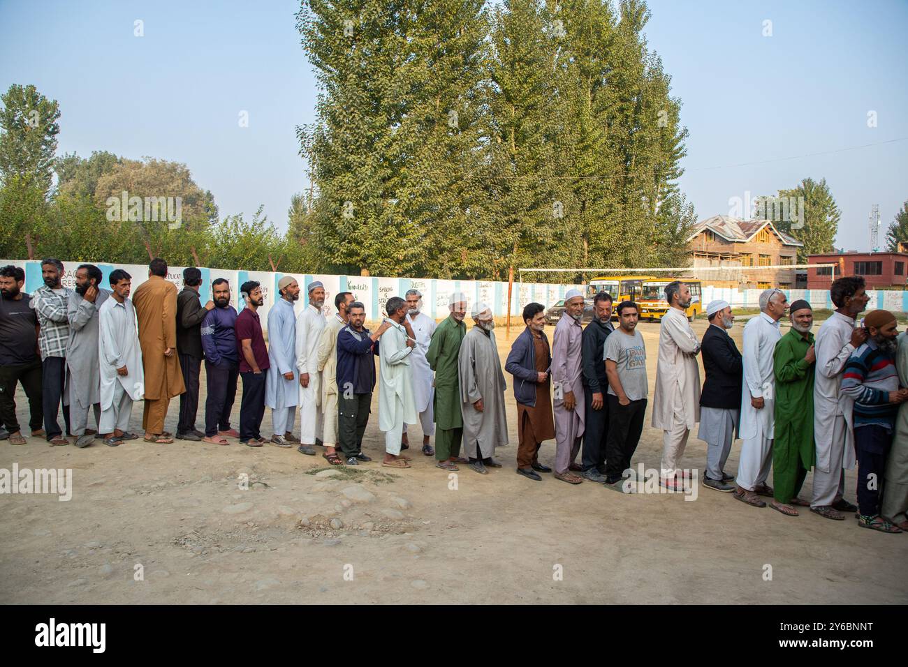 Srinagar, India. 25th Sep, 2024. Kashmiri voters wait in a queue to ...