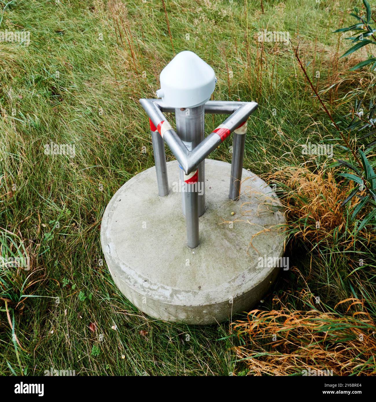 groundwater monitoring station in concrete base with protective ...