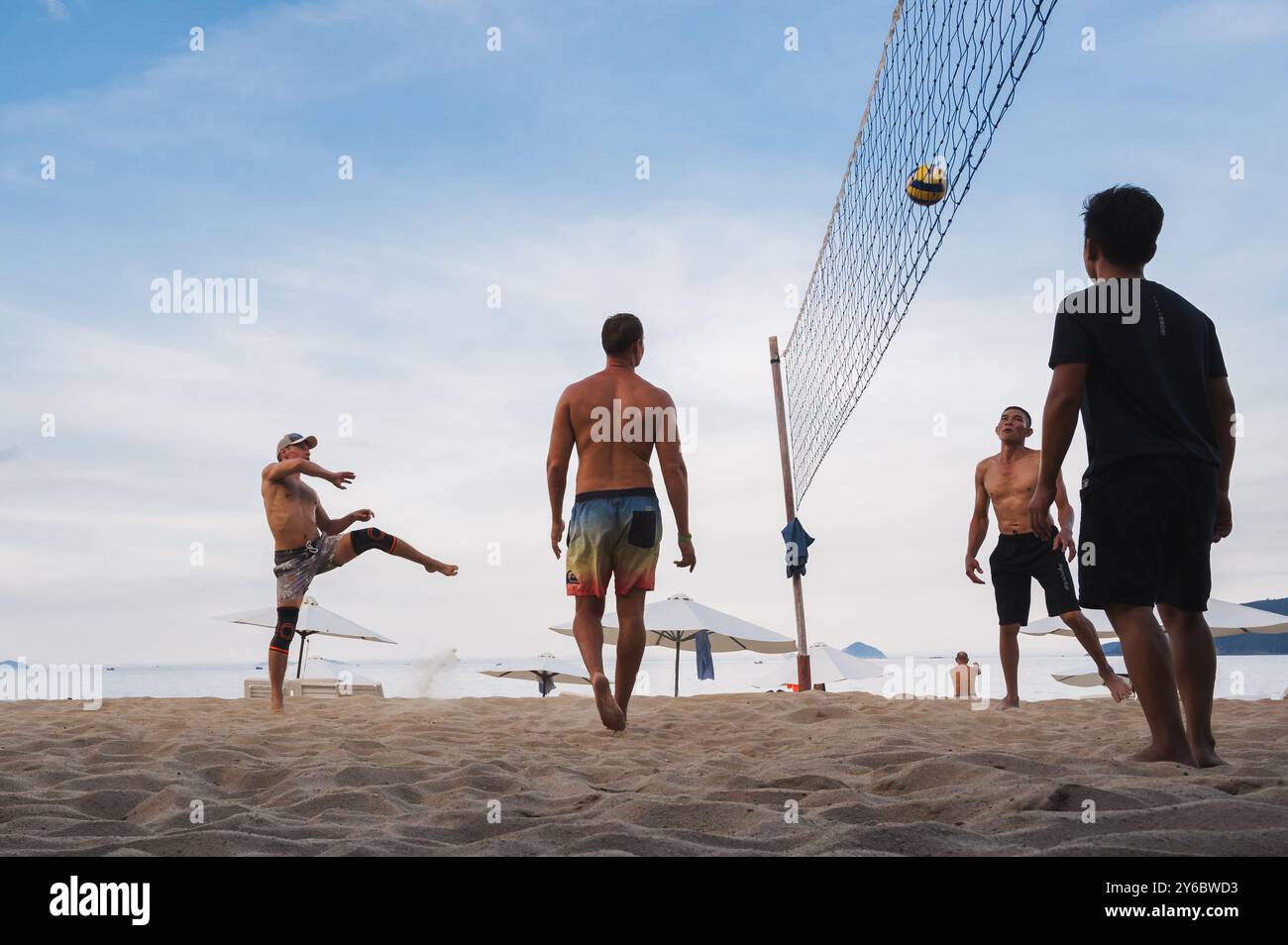 Multinational players play beach volleyball by the sea in Nha Trang in ...
