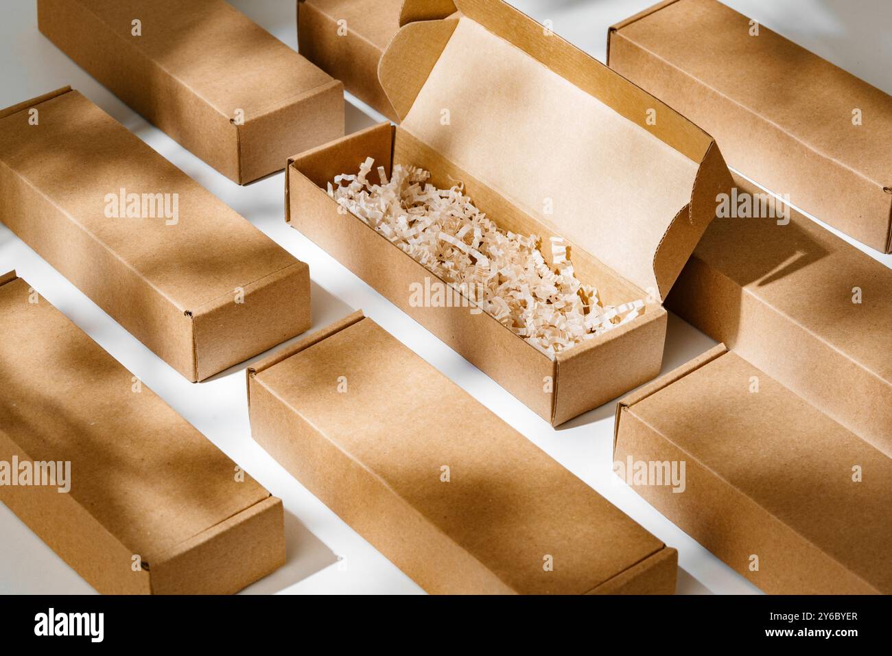 Brown cardboard boxes arranged neatly on a workspace, showcasing ...