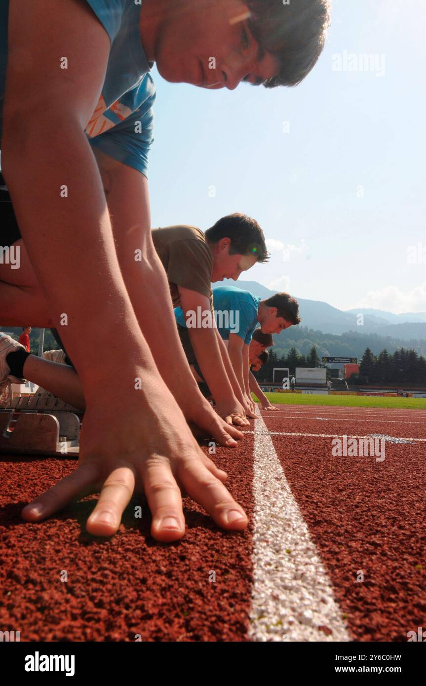 children in start position on the running track, running sport in the ...