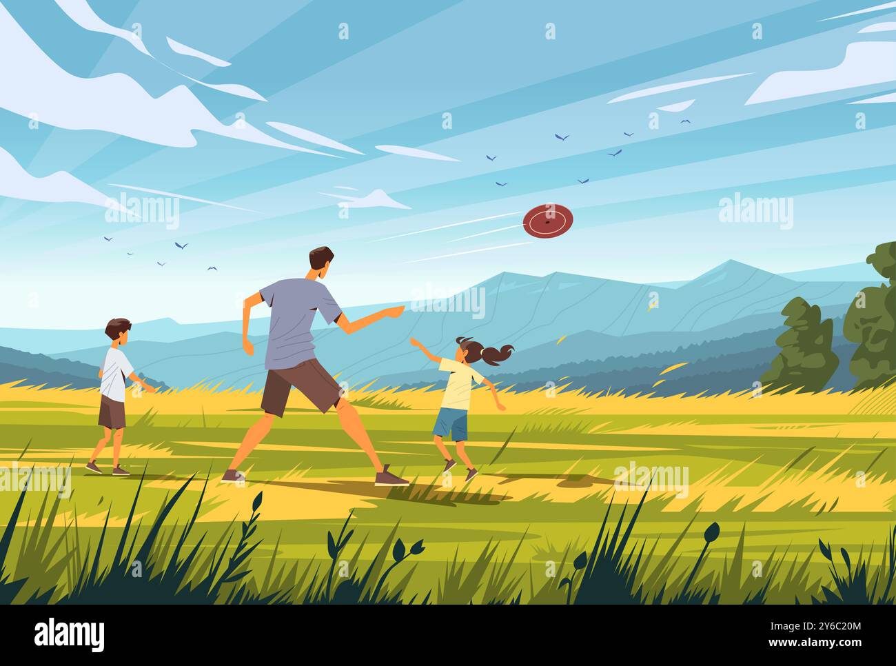 Family outdoor activity playing frisbee in open field with mountains in ...