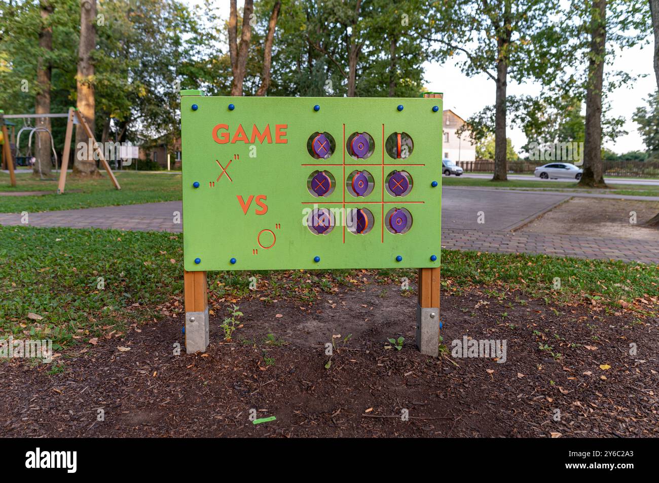 A large tic-tac-toe game board is set up in a park for public enjoyment ...
