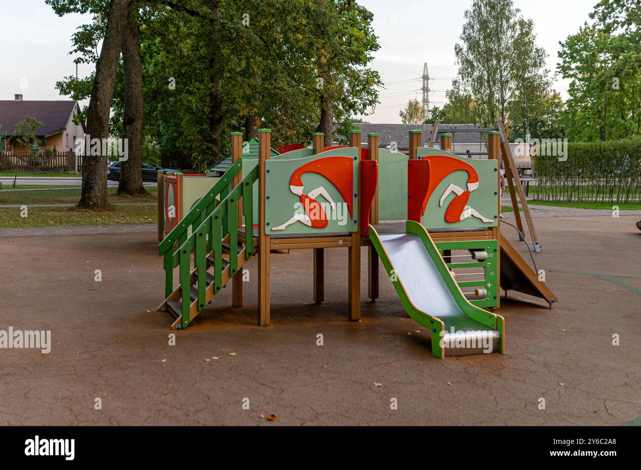 Childrens playground features climbing structures and a slide in a ...