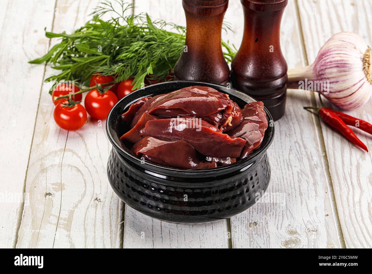 Raw chicken liver uncooked in the bowl with spices Stock Photo - Alamy