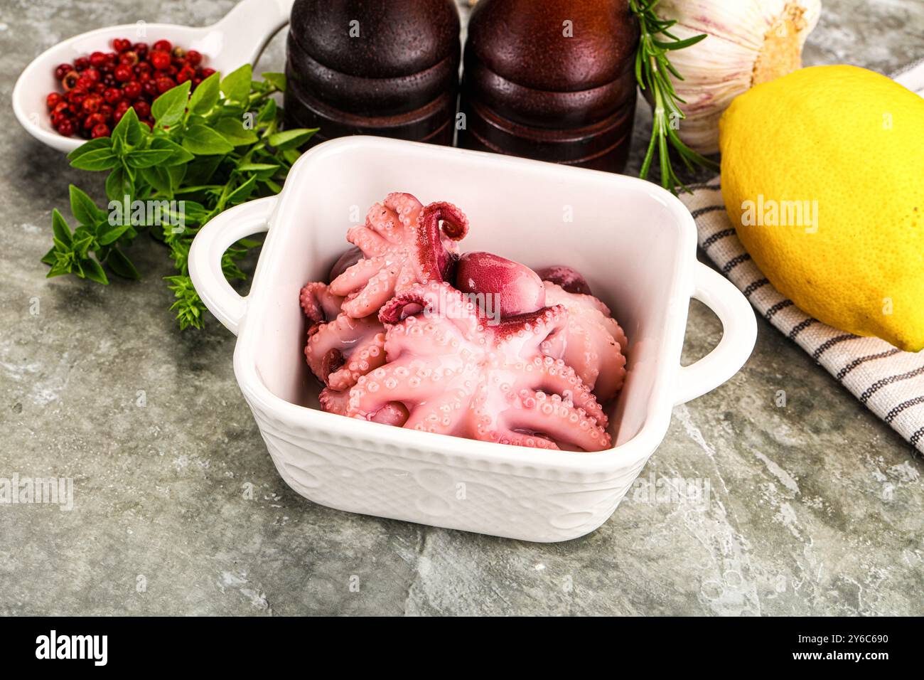 Marinated baby octopus snack appetizer served lemon Stock Photo - Alamy
