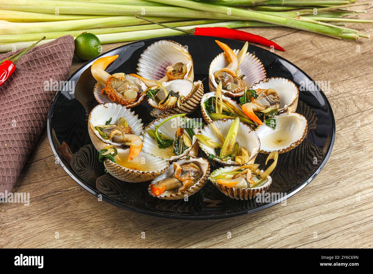 Delicous Asian mollusk shell steamed with spices Stock Photo - Alamy