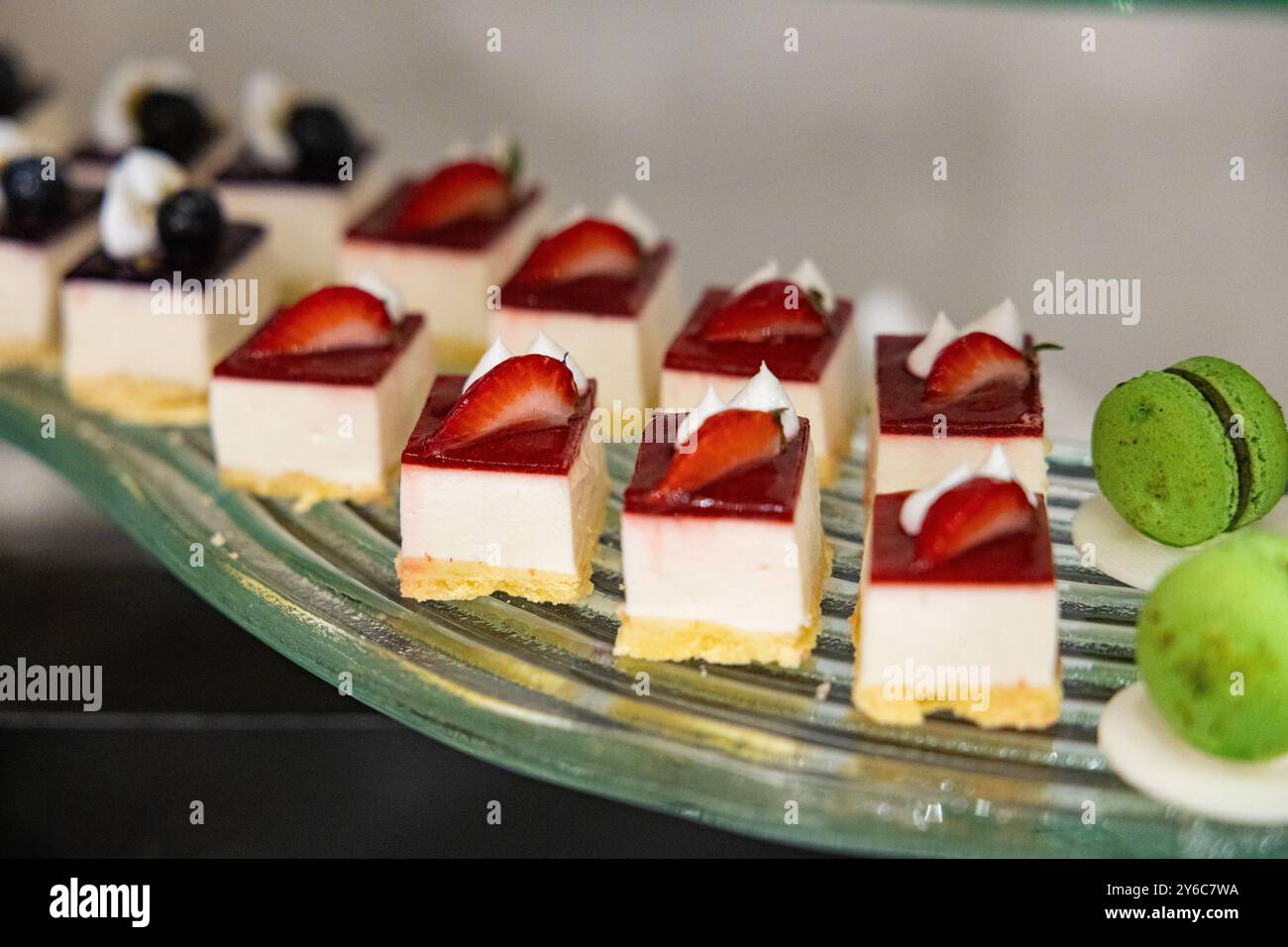 Mini Strawberry cheesecake in buffet line Stock Photo - Alamy