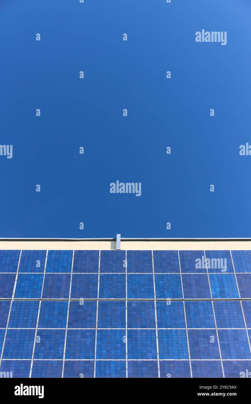 Many solar panels texture with copyspace vertical shot. Building with ...