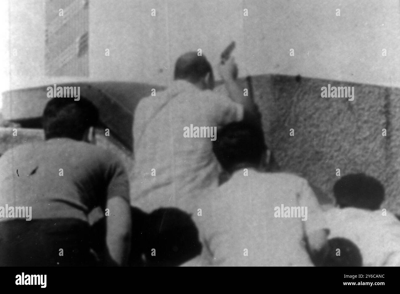 Hide behind white wall Black and White Stock Photos & Images - Alamy