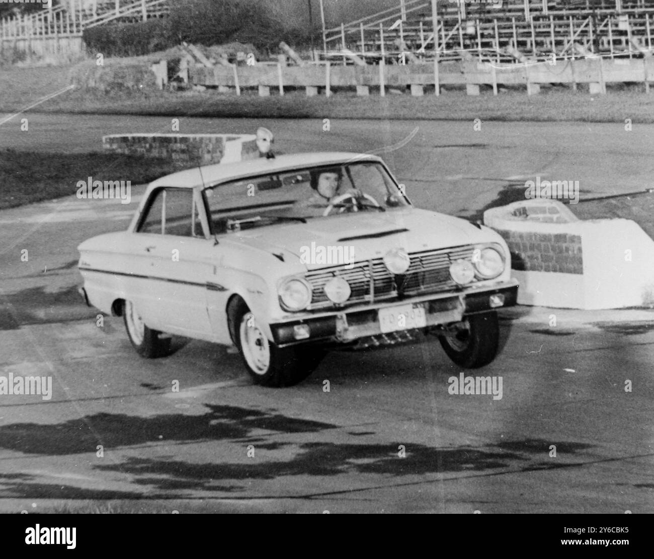 RACING DRIVER GRAHAM HILL IN FORD FALCON FUTURA SPRINT AT GOODWOOD ...