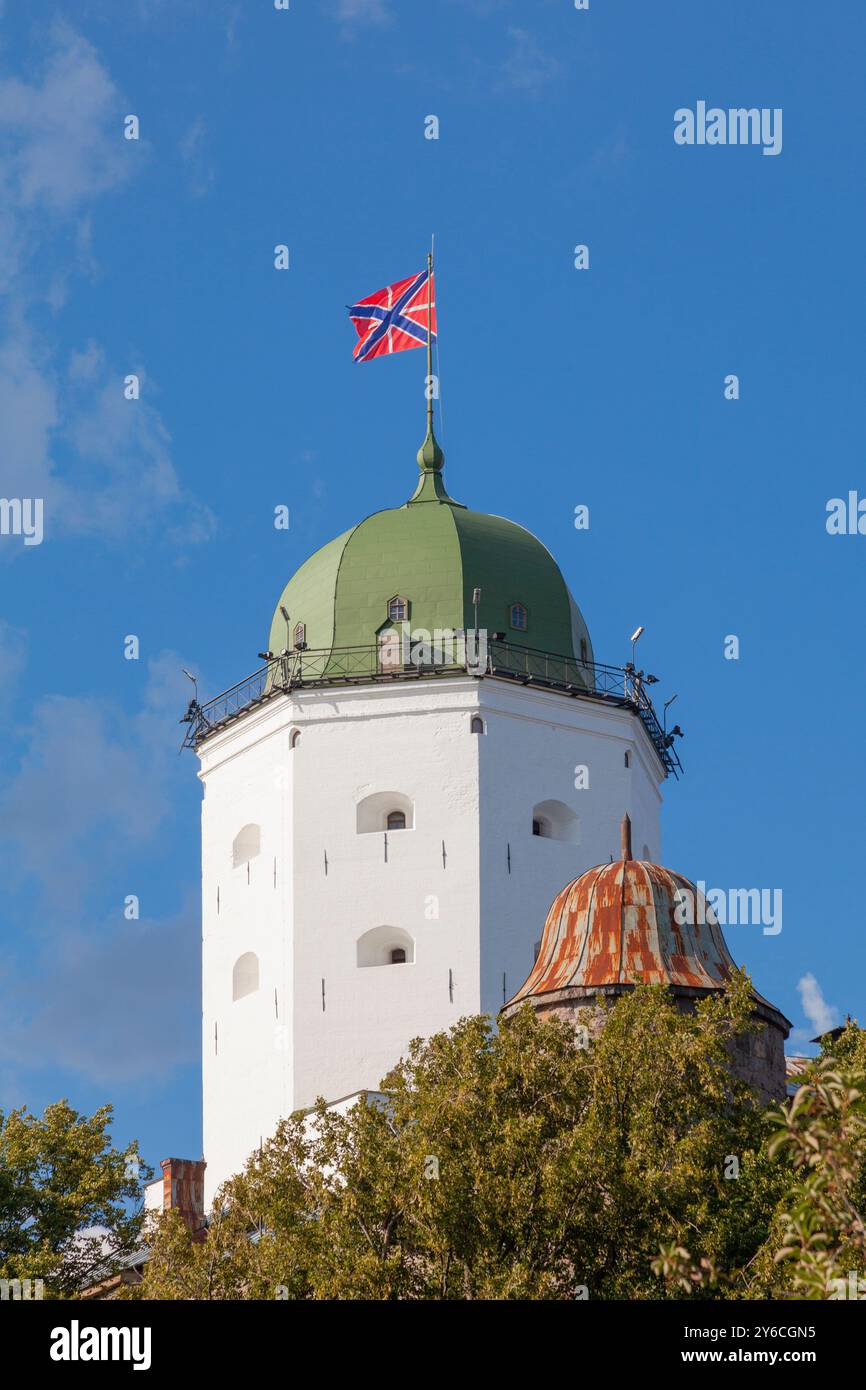 The naval flag of the Russian Empire flies on the tower of the Vyborg ...