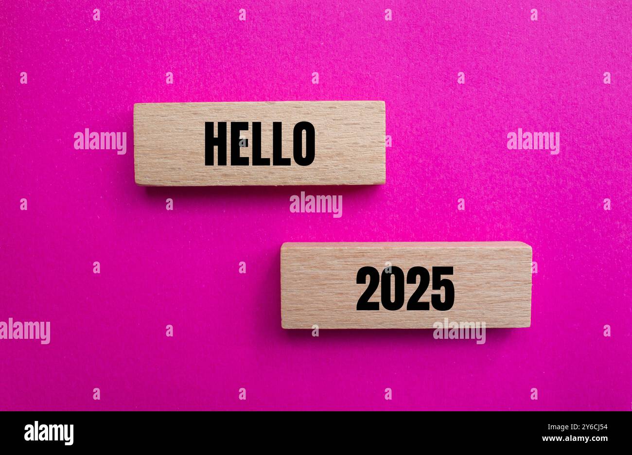 Hello 2025 message written on wooden blocks with pink background ...