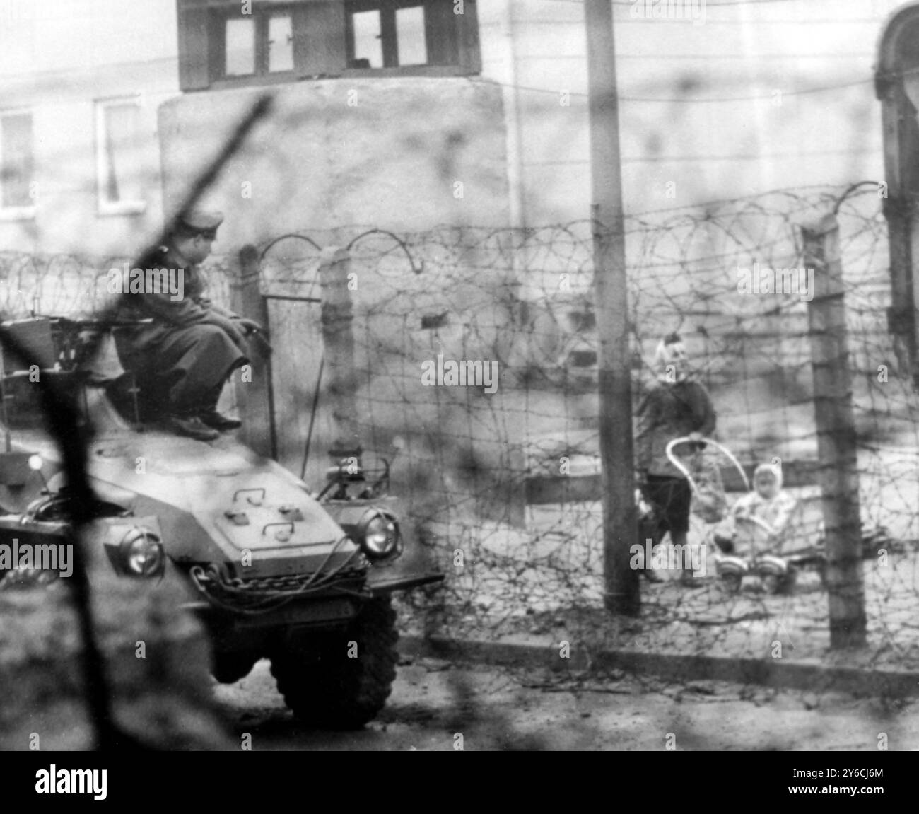 29 NOVEMBER 1963 THROUGH THE BARBED WIRE OF THE BERLIN WALL A WOMAN ...