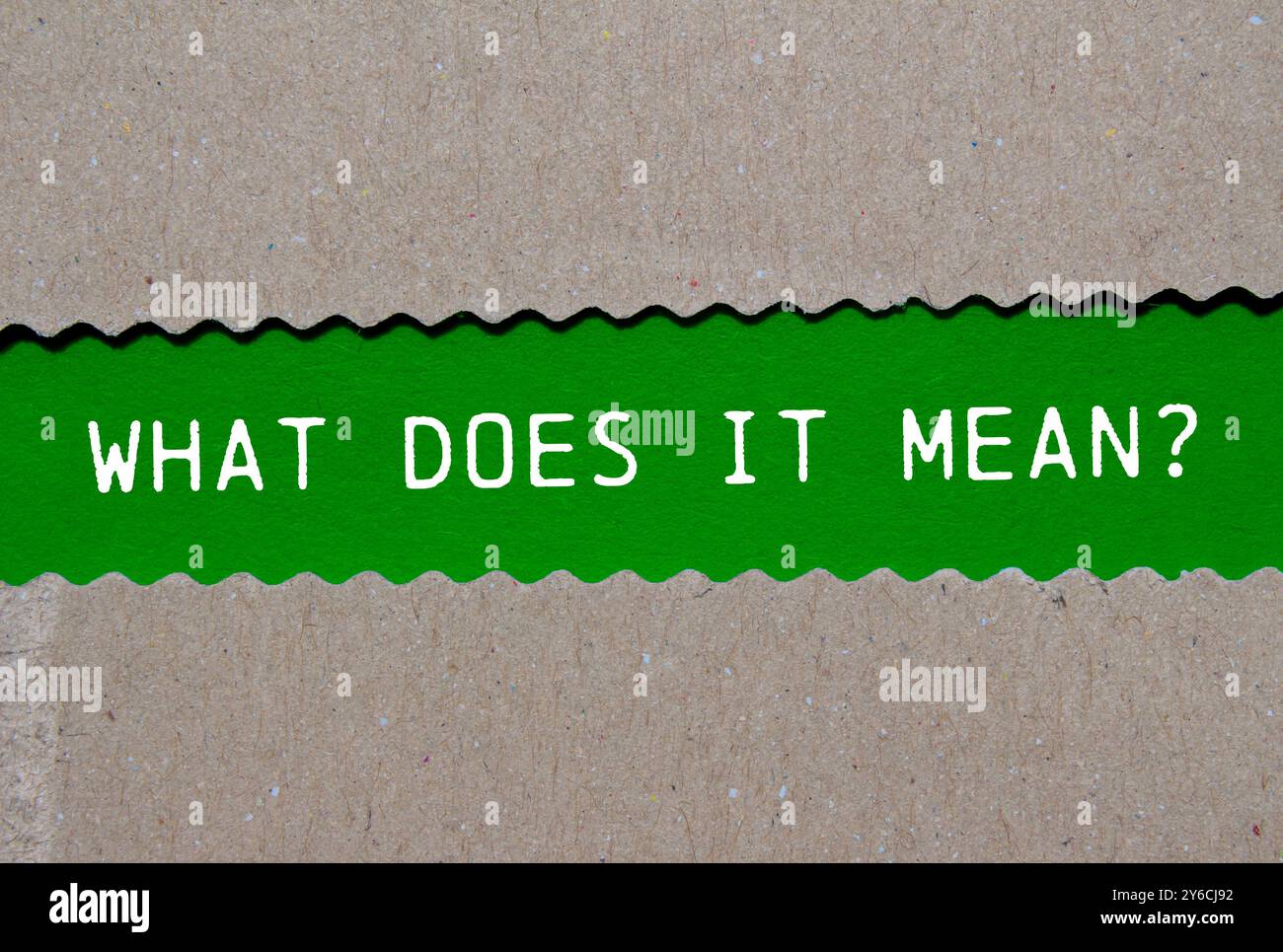 What does it mean question written on ripped torn paper on green ...