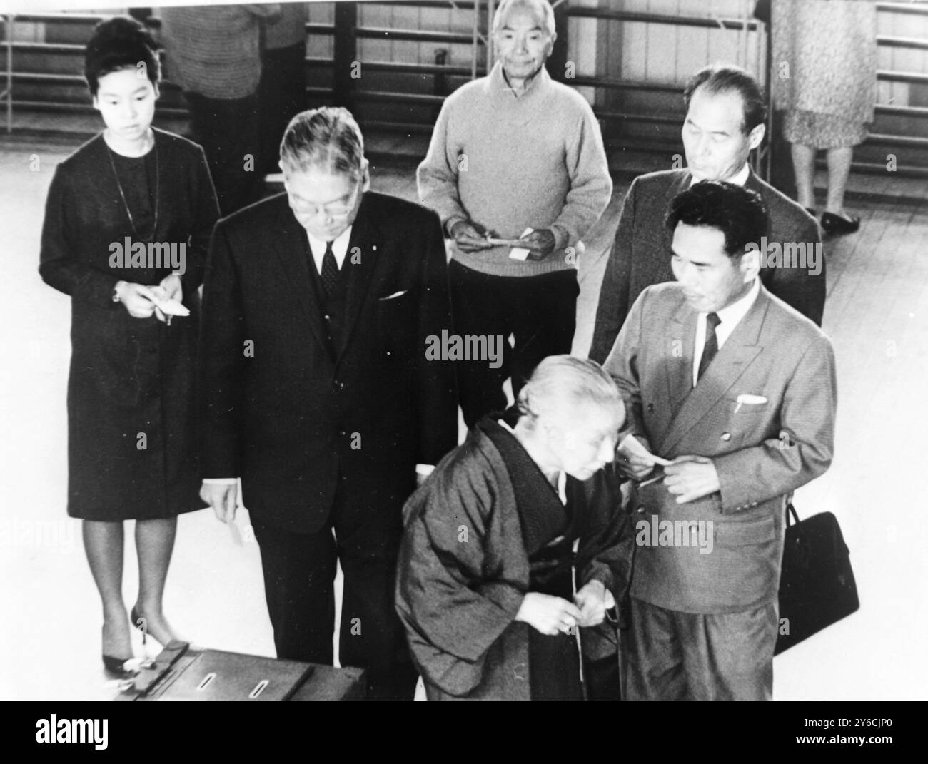 JAPANESE PRIME MINISTER HAYATO IKEDA AND FATHER SACHIKO VOTING IN TOKYO ...