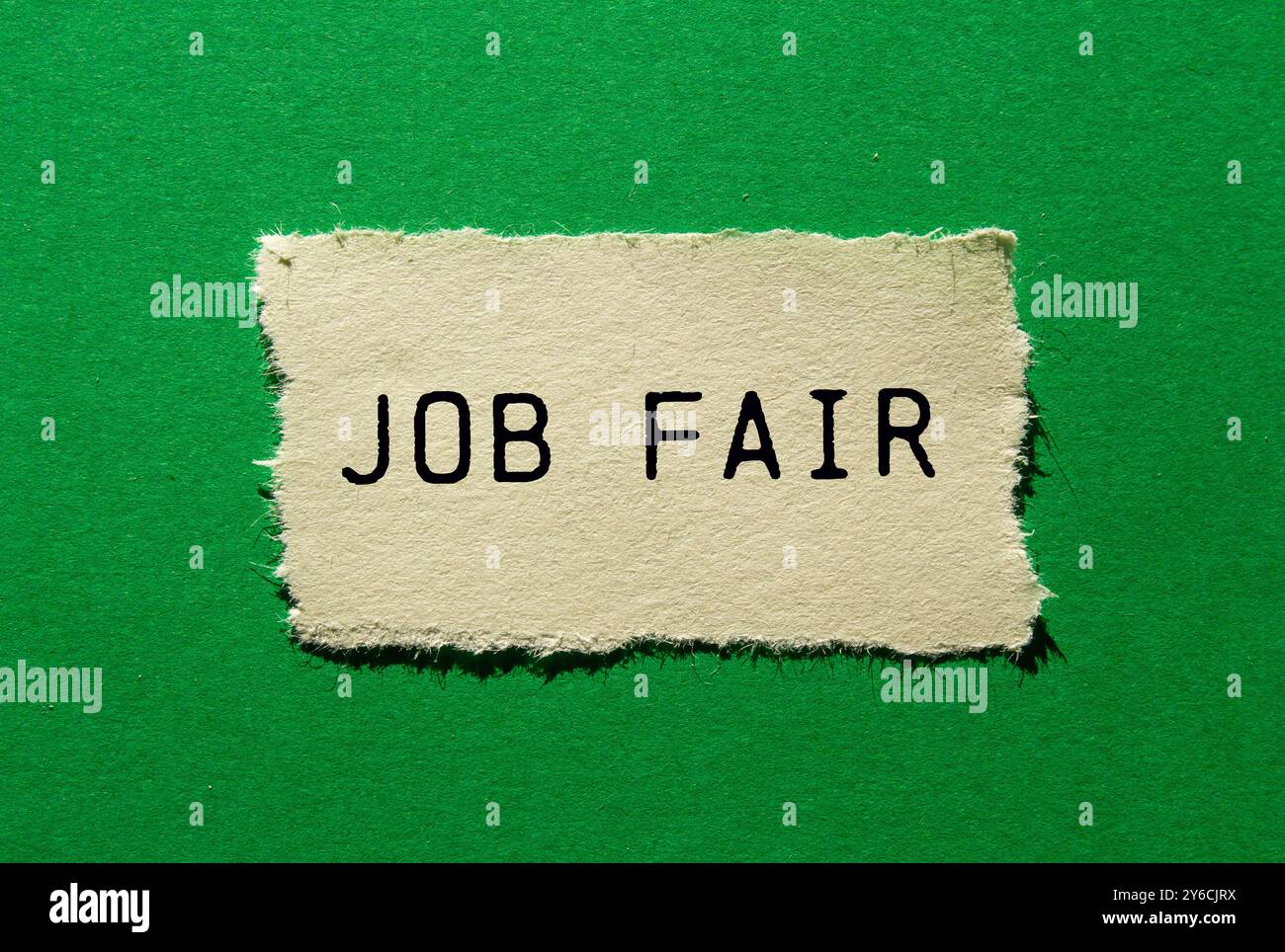 Job fair message written on ripped torn paper piece on green background ...