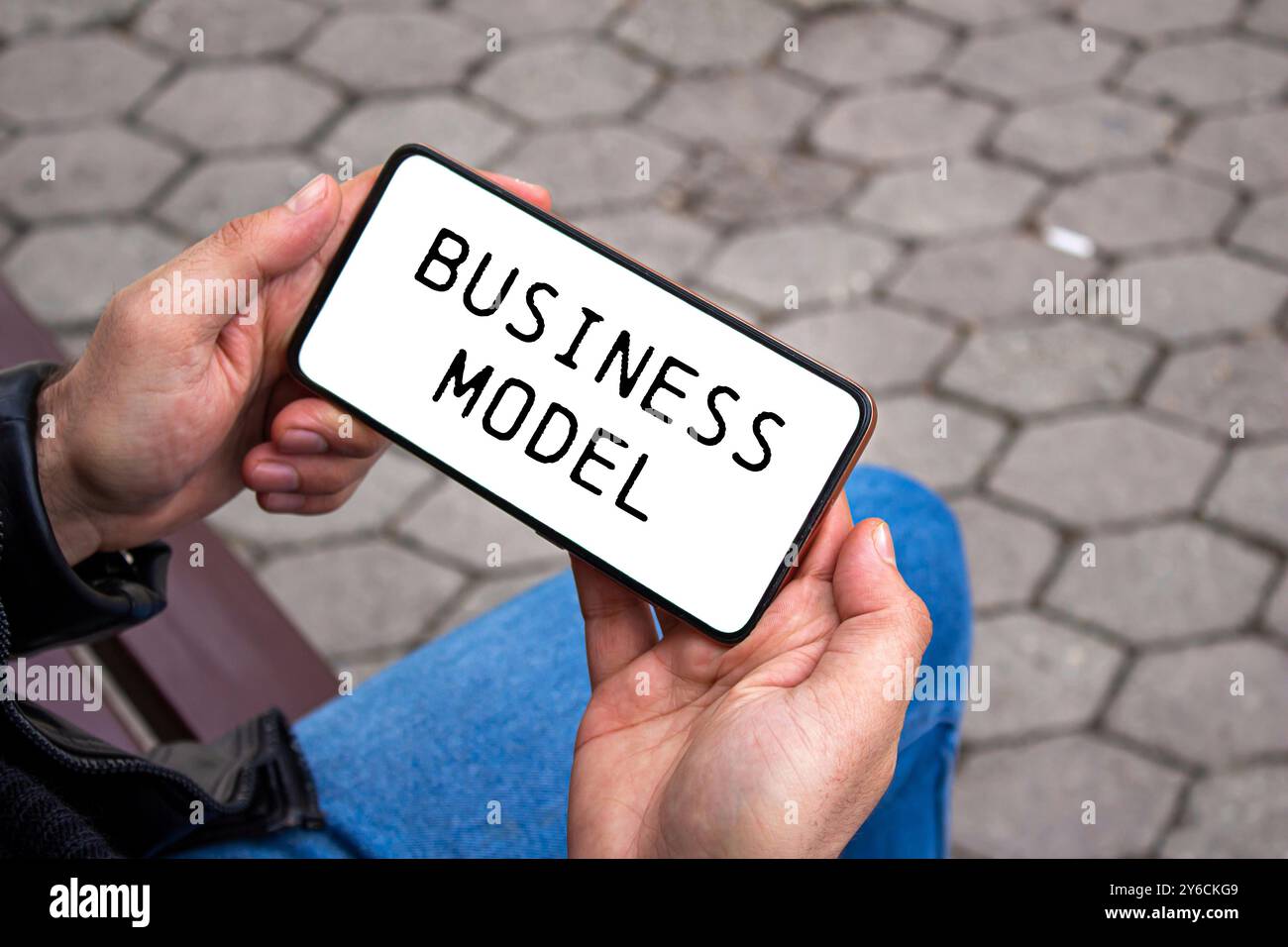 Business model message written on smartphone screen. Conceptual ...