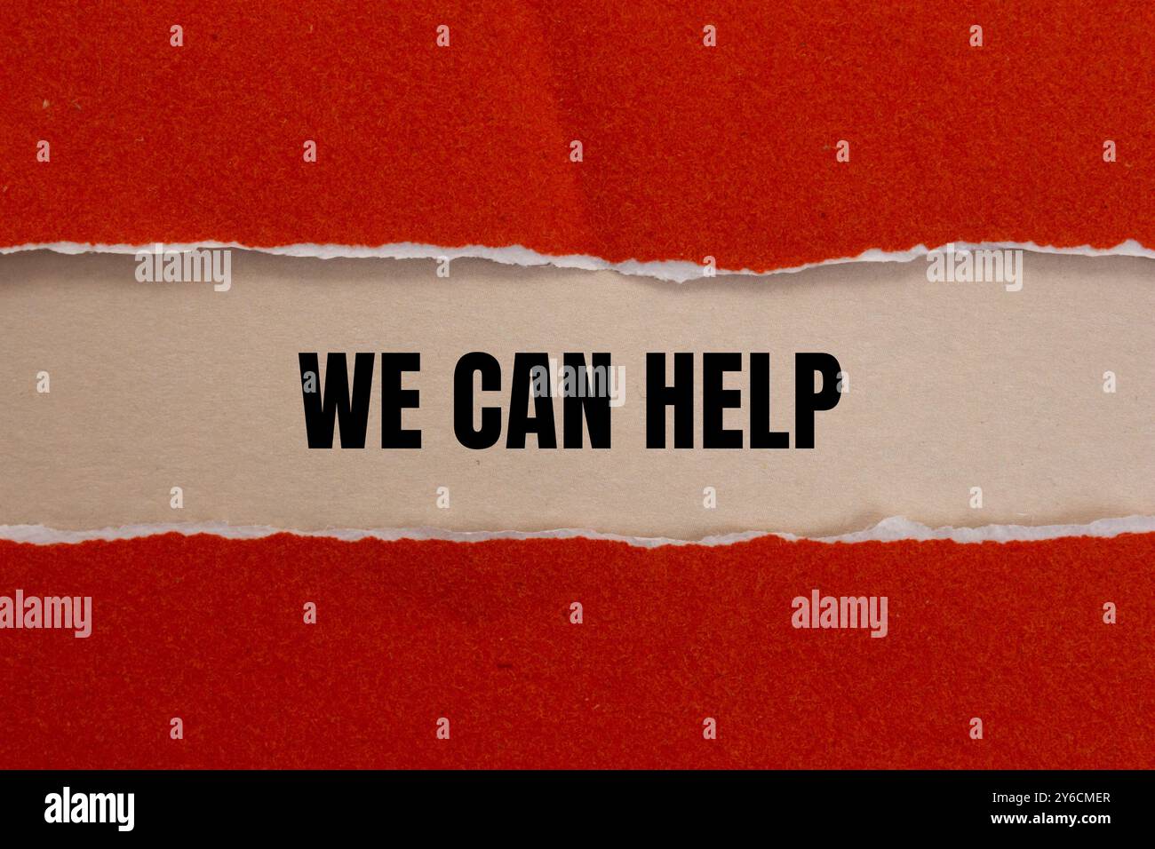 We can help message written on ripped red torn paper with beige ...