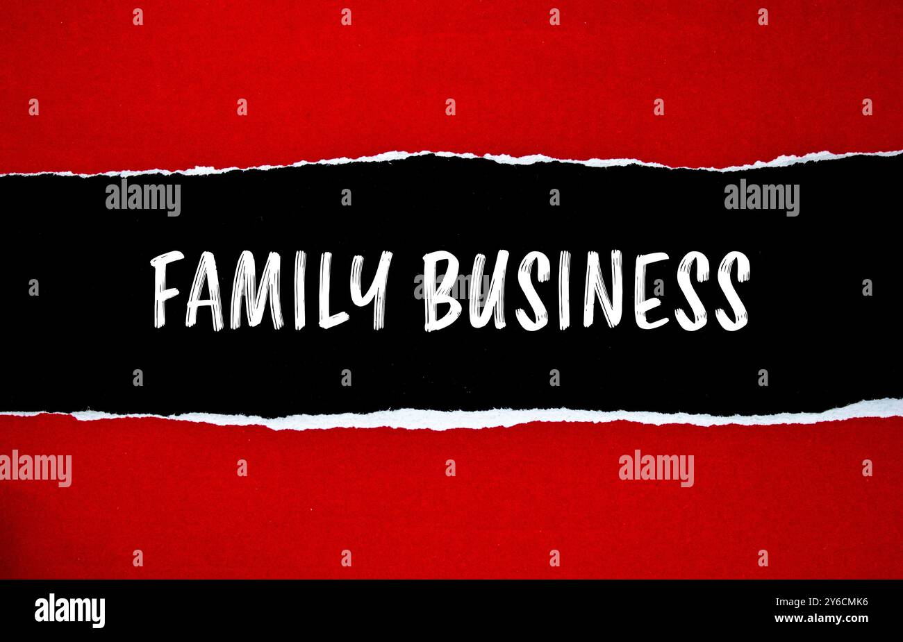 Family business message written on ripped torn red paper with black background. Conceptual ...