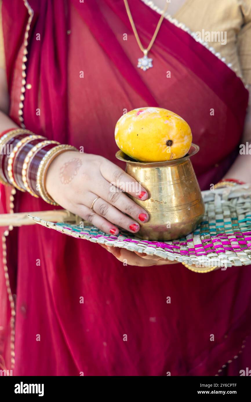 devotee holding holy offerings for worshiping of god at day on the ...