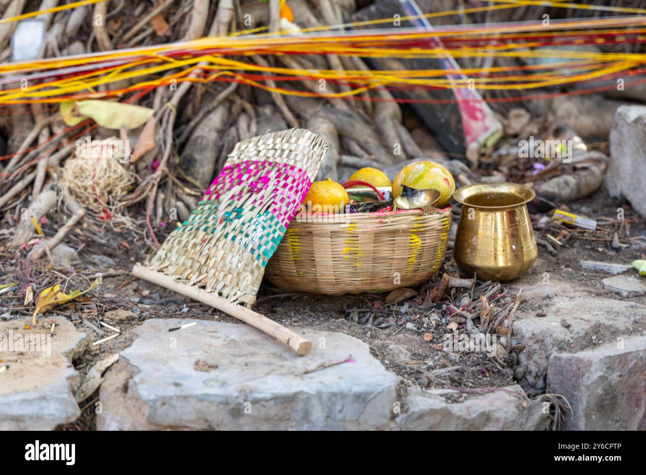 worships of holy banyan tree with offerings and bamboo hand fan at day ...