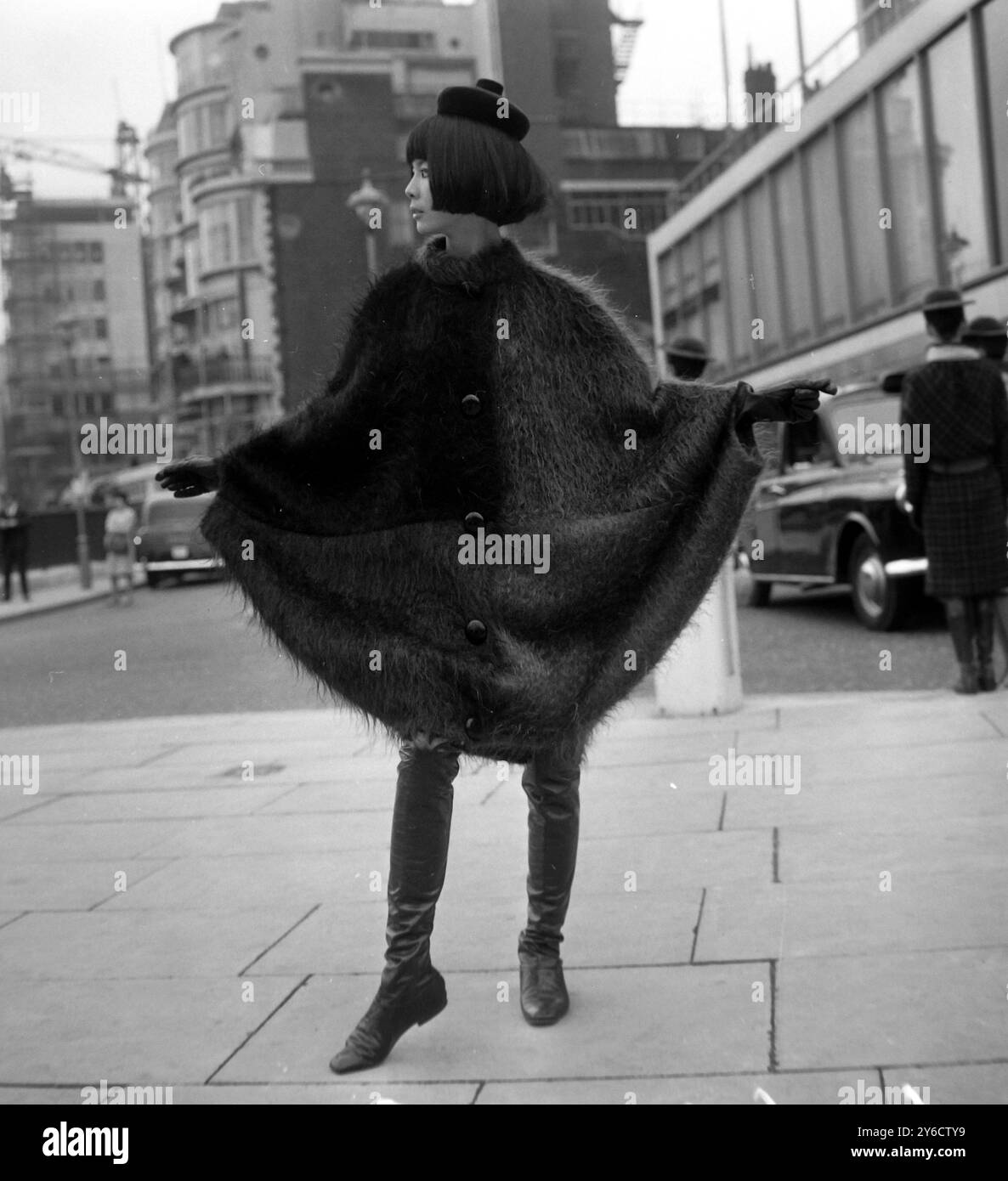 Model Hiroko models Pierre Cardin 's batwinged looking winter cape with ...