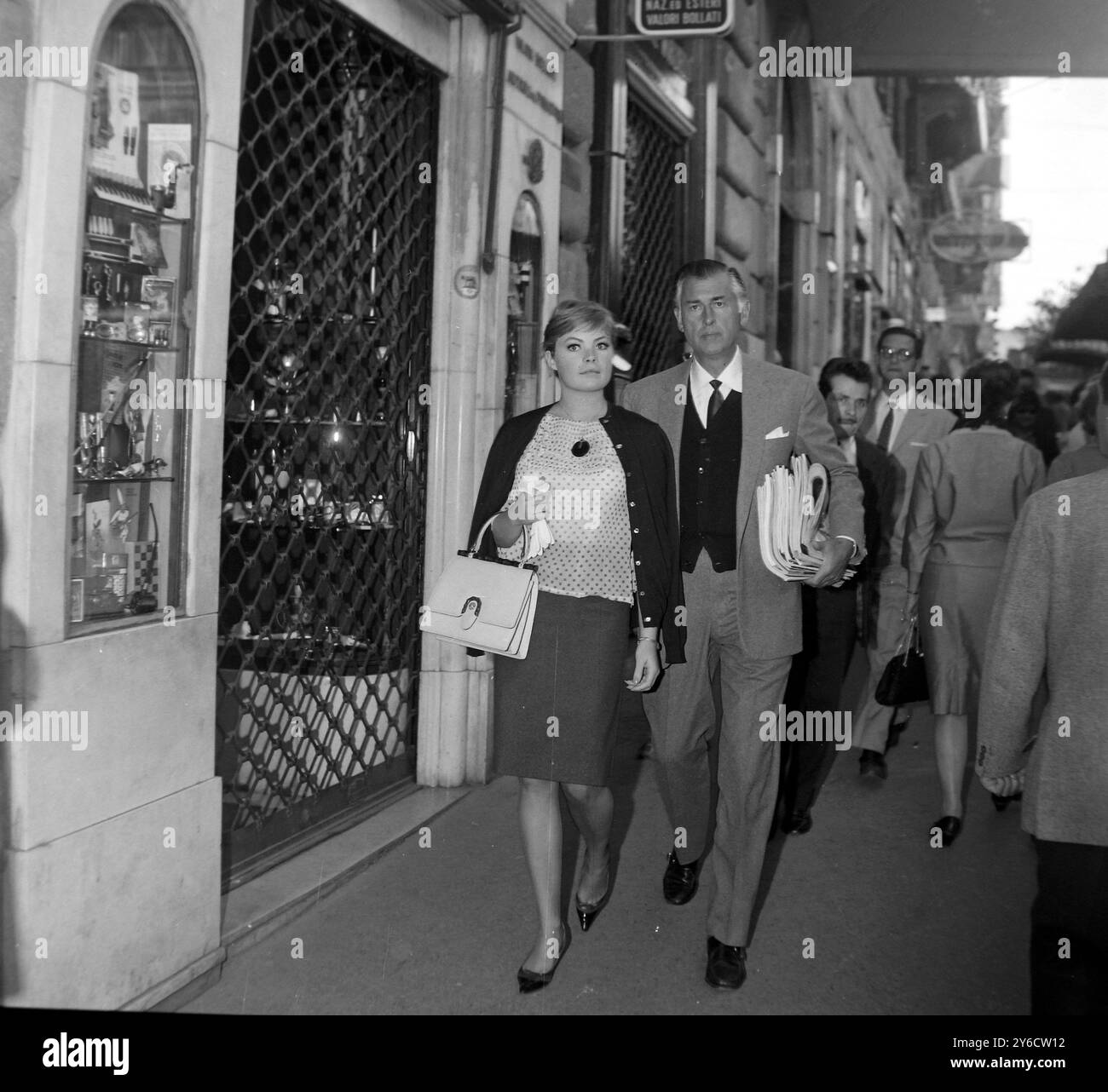 STEWART GRANGER WITH CAROLINE LECERF CARRYING MAGAZINES IN ROME / ; 16 ...