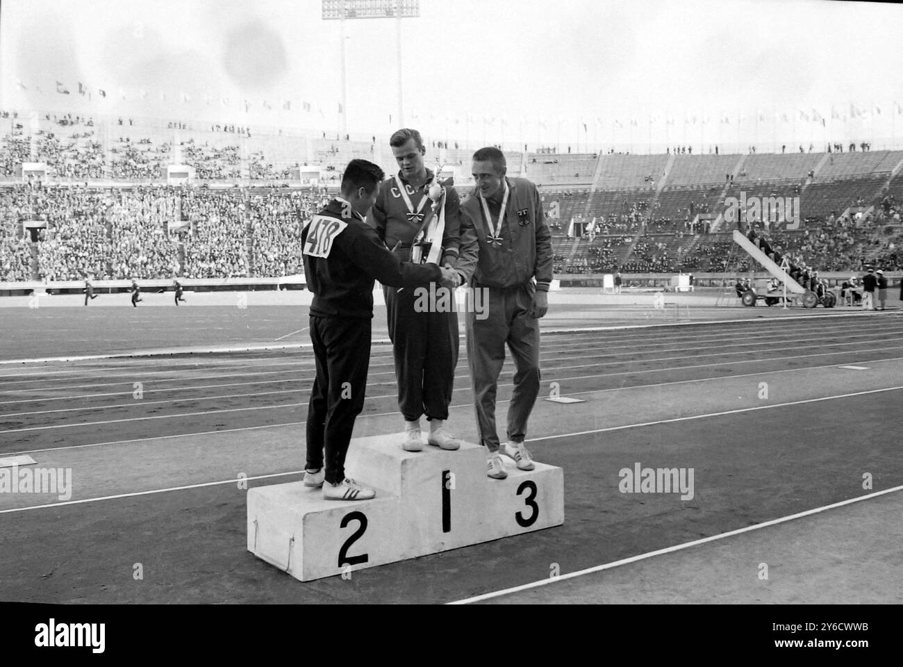 ATHLETES ON PODIUM - TAKASHI MIKI, JANIS LUSIS AND HEINRICH ZAMETZER IN ...