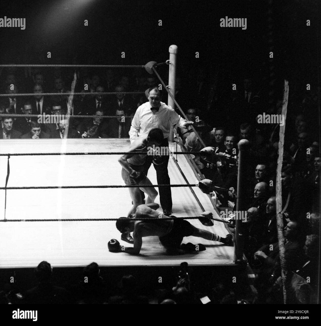 BOXING FEATHERWEIGHT FRANKIE TAYLOR F STANDS OVER HAROLD GOMES IN ...