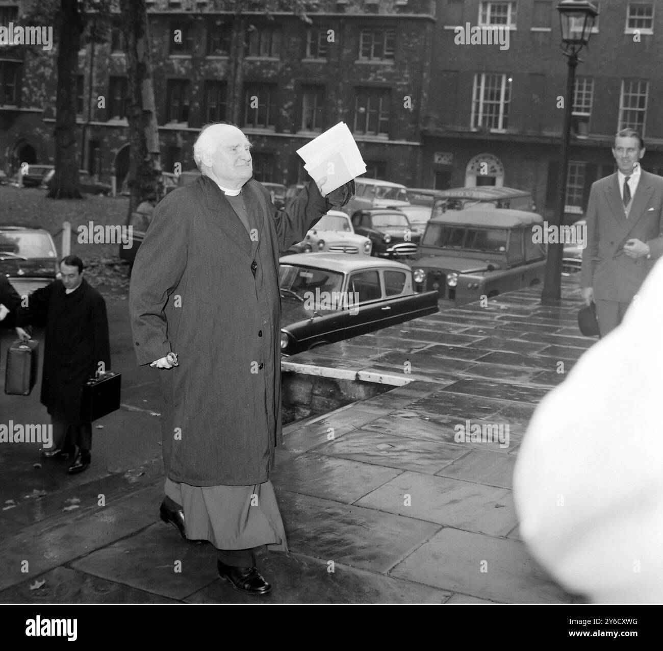 ARCHBISHOP OF CANTERBURY MICHAEL RAMSEY WEARING A RAINCOAT IN LONDON ...