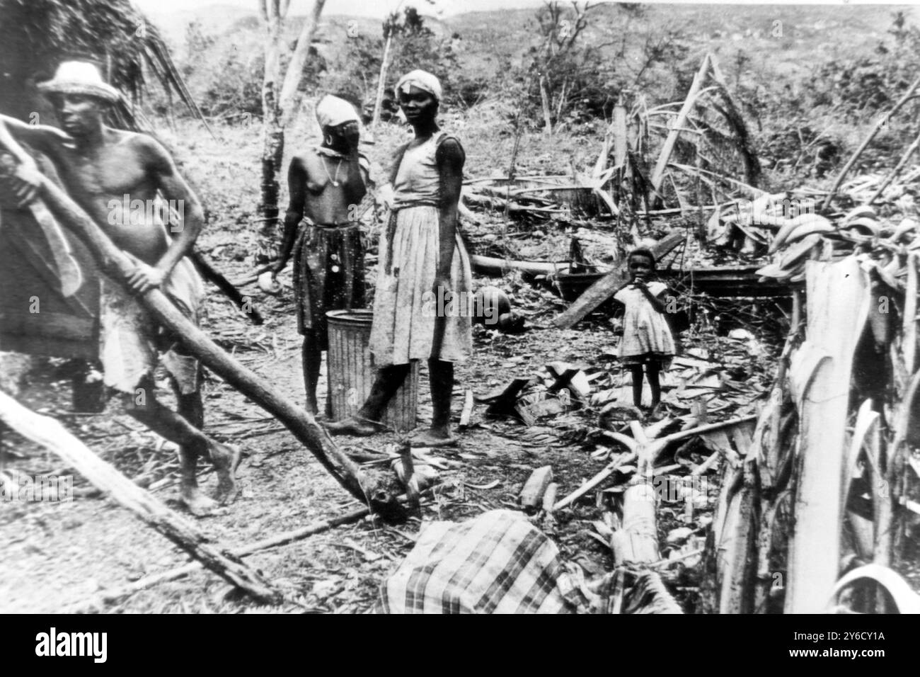 HURRICANE FLORA, FAMILY STAND AMID RUINS OF HOME IN HAITI ; 8 OCTOBER ...