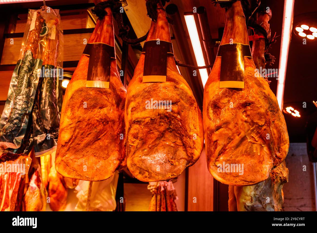 Jamon serrano ham legs hanging in a traditional spanish market Stock ...