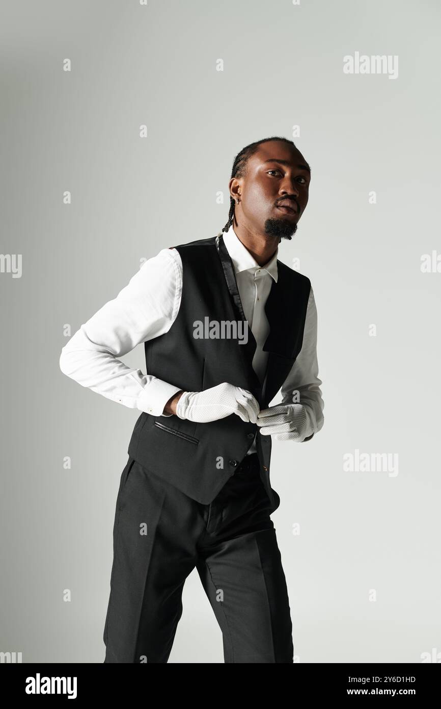 A young man exudes confidence while wearing a modern suit and vest on a ...