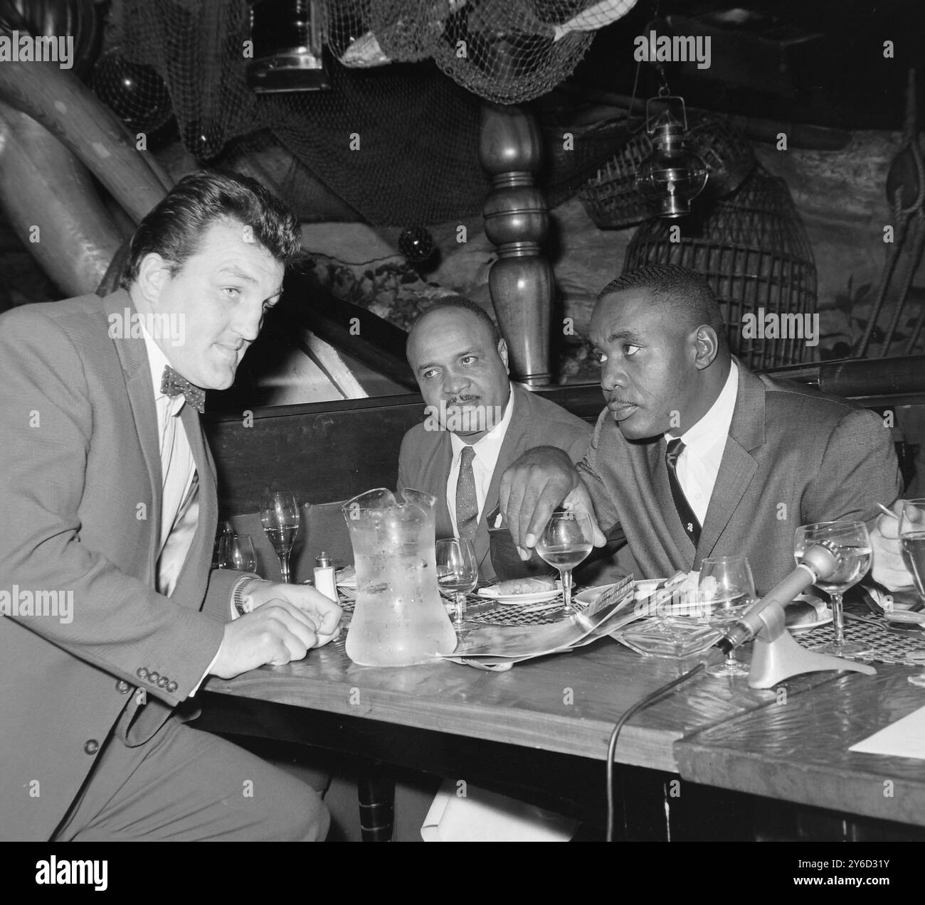 BOXER SONNY LISTON SHOWS HANDS FOR PRESS IN LONDON WITH BILLY WALKER ...