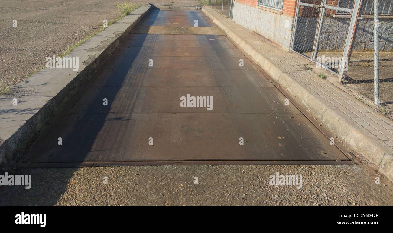 Truck scale installed on the right side of a local road. Faclity used ...