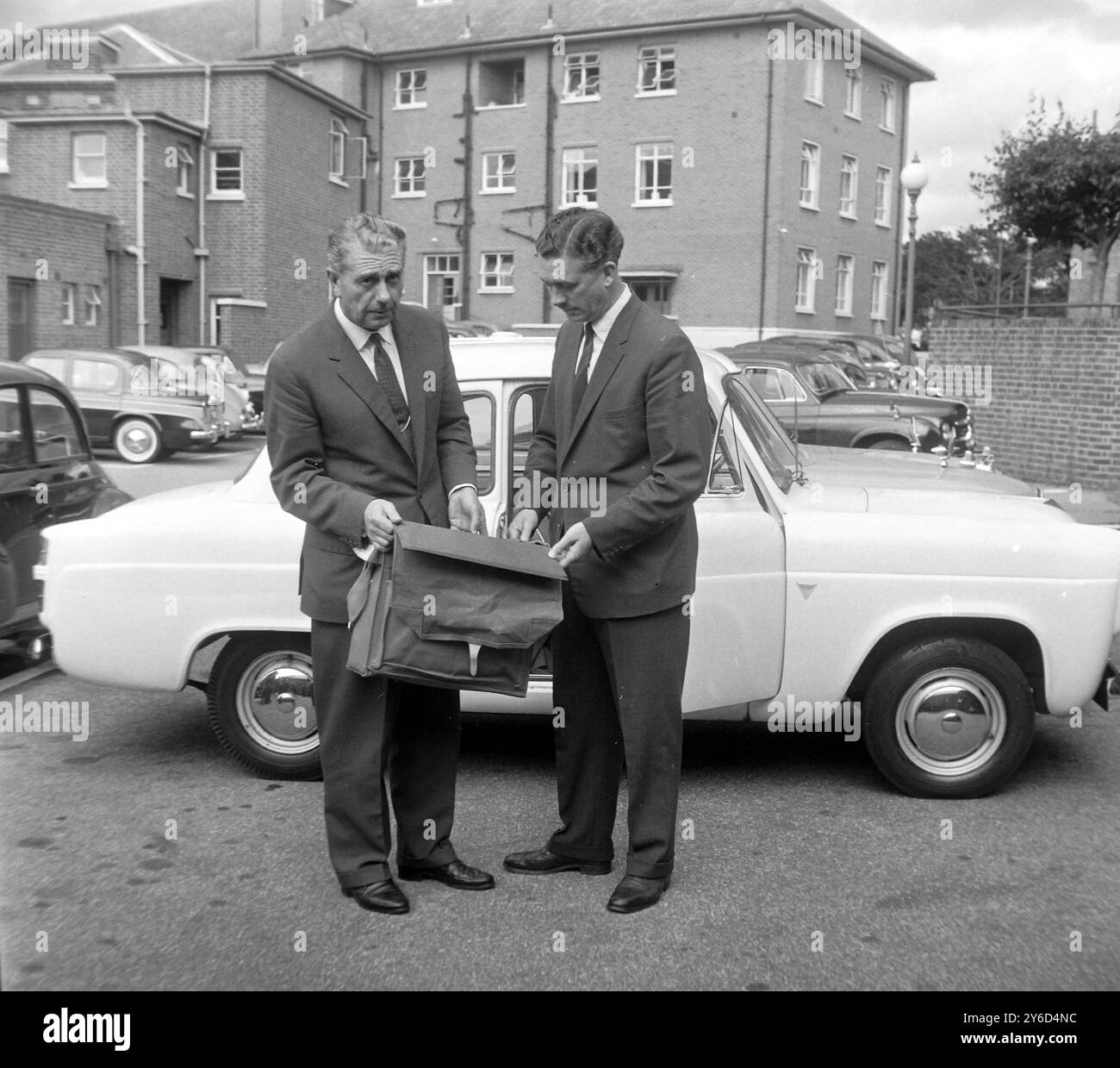 ROBBERIES POLICE AND PRESS INSPECT 2 VEHICLES USED AS A GETAWAY AFTER ...