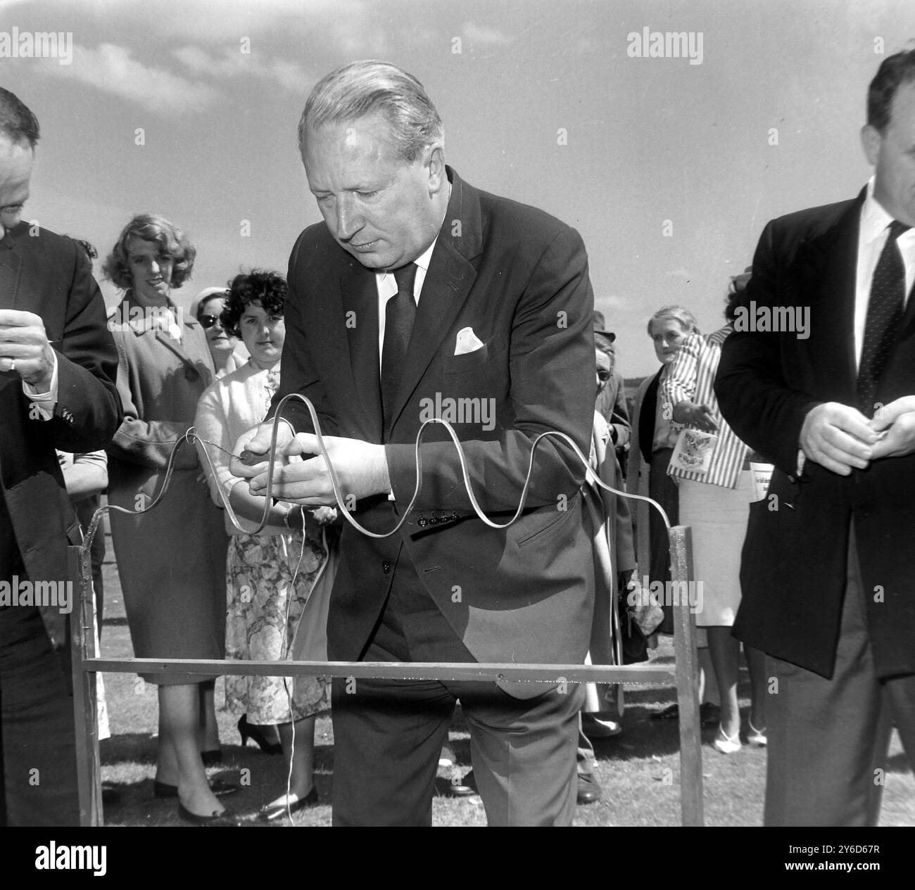 EDWARD HEATH PLAYS METAL RING GAME IN CANTERBURY, KENT / ; 27 JULY 1963 ...