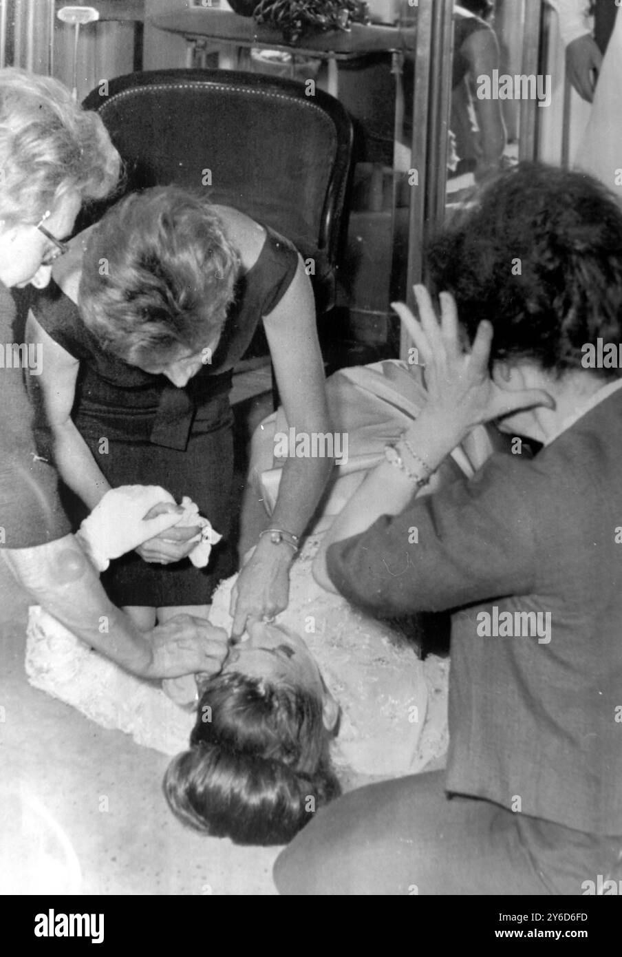 FASHION MODEL FAINTS IN PARIS / ; 24 JULY 1963 Stock Photo - Alamy