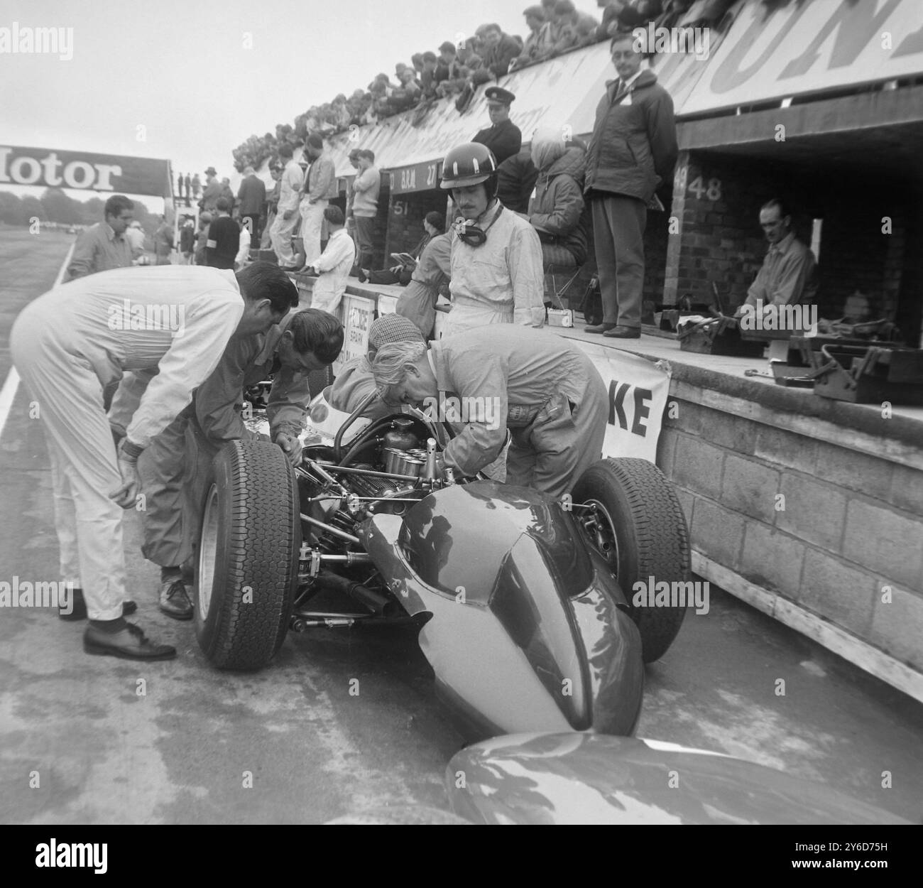 RACING DRIVER GRAHAM HILL WITH MECHANICS AT SILVERSTONE NEAR BRM ; 18 ...