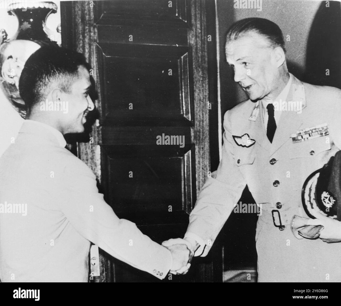 KING HUSSEIN OF JORDAN AND GENERAL BULL SHAKE HANDS IN AMMAN ; 8 JULY ...