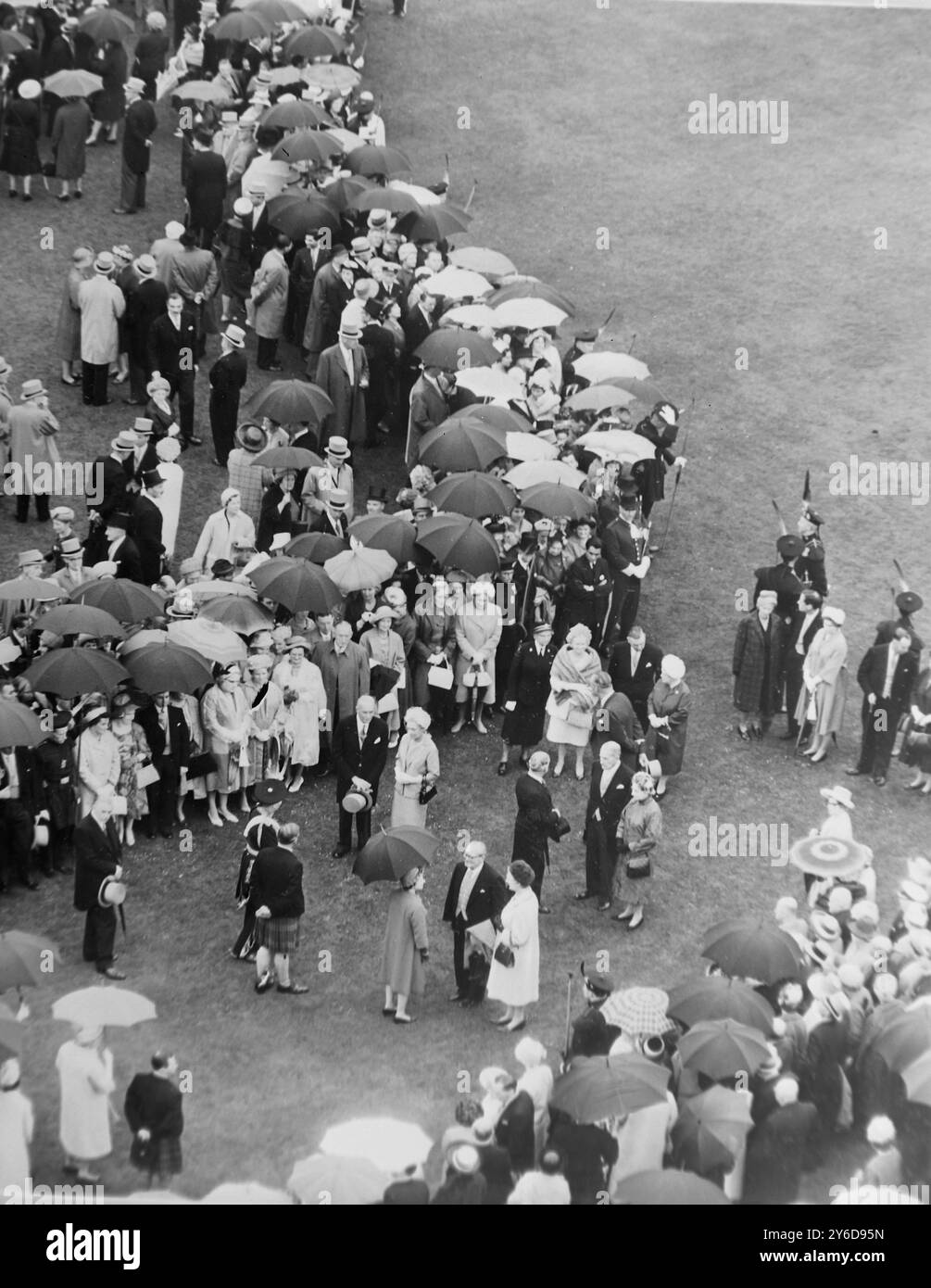 QUEEN ELIZABETH II WITH PRINCE PHILIP UNDER UMBRELLA AT ROYAL GARDEN ...